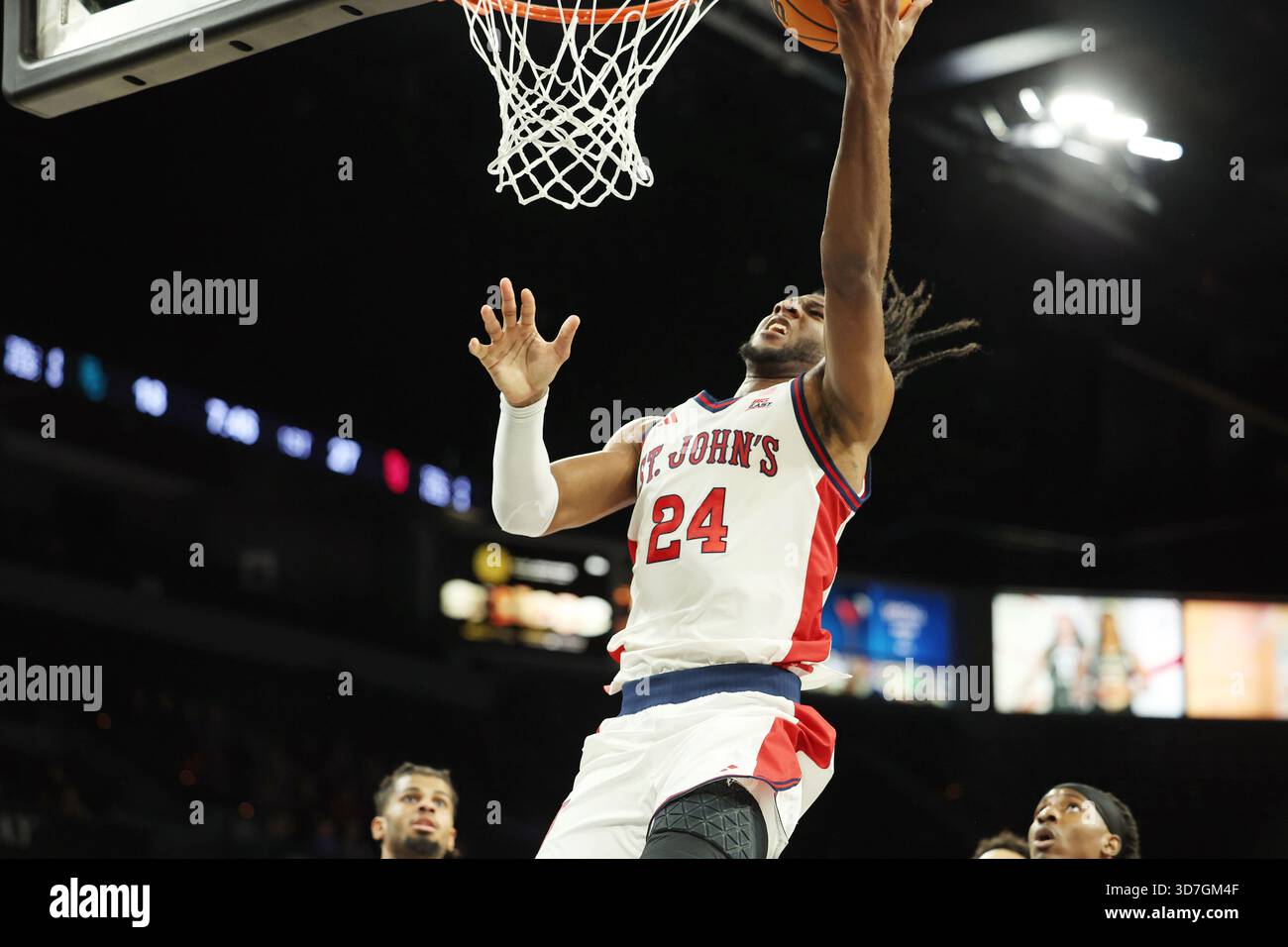 St. John's forward Zuby Ejiofor (24) lays up the ball during the first ...