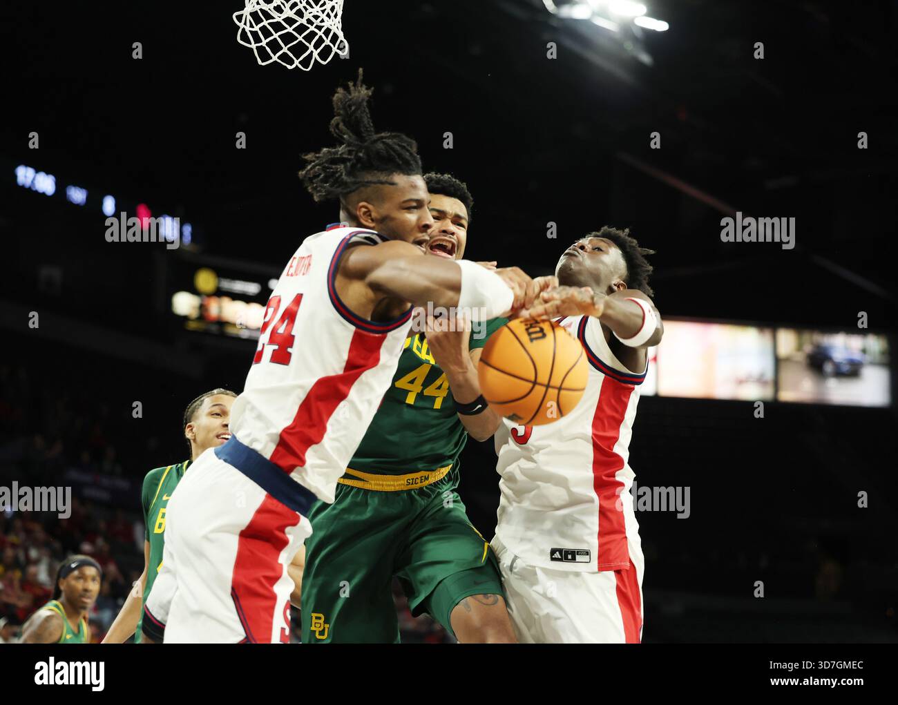 St. John's forward Zuby Ejiofor (24) and guard Joson Sanon (3) compete ...