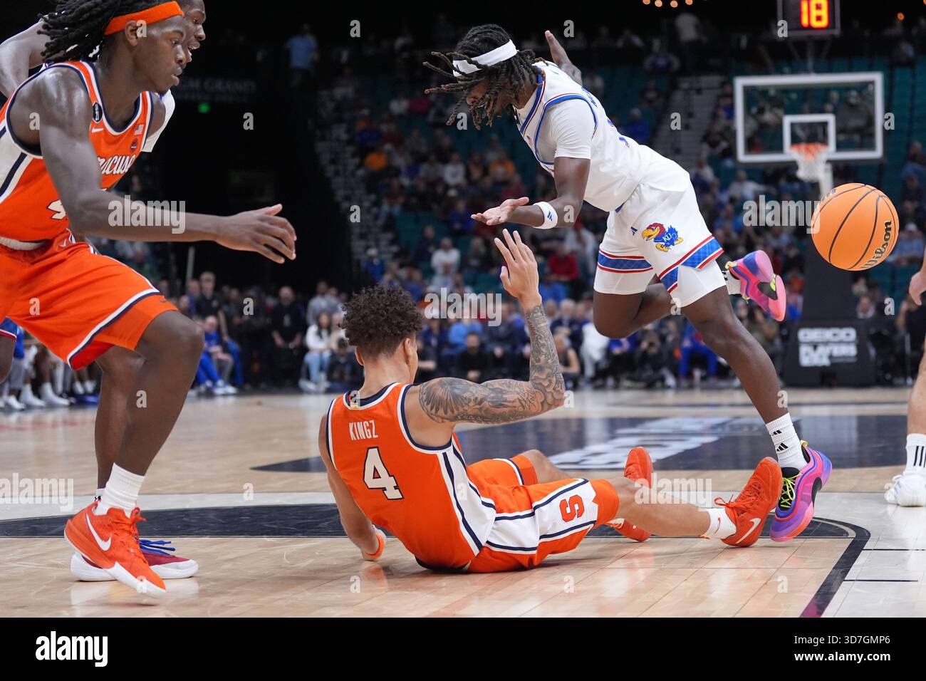 Syracuse guard Nate Kingz (4) is fouled by Kansas guard Jamari McDowell ...