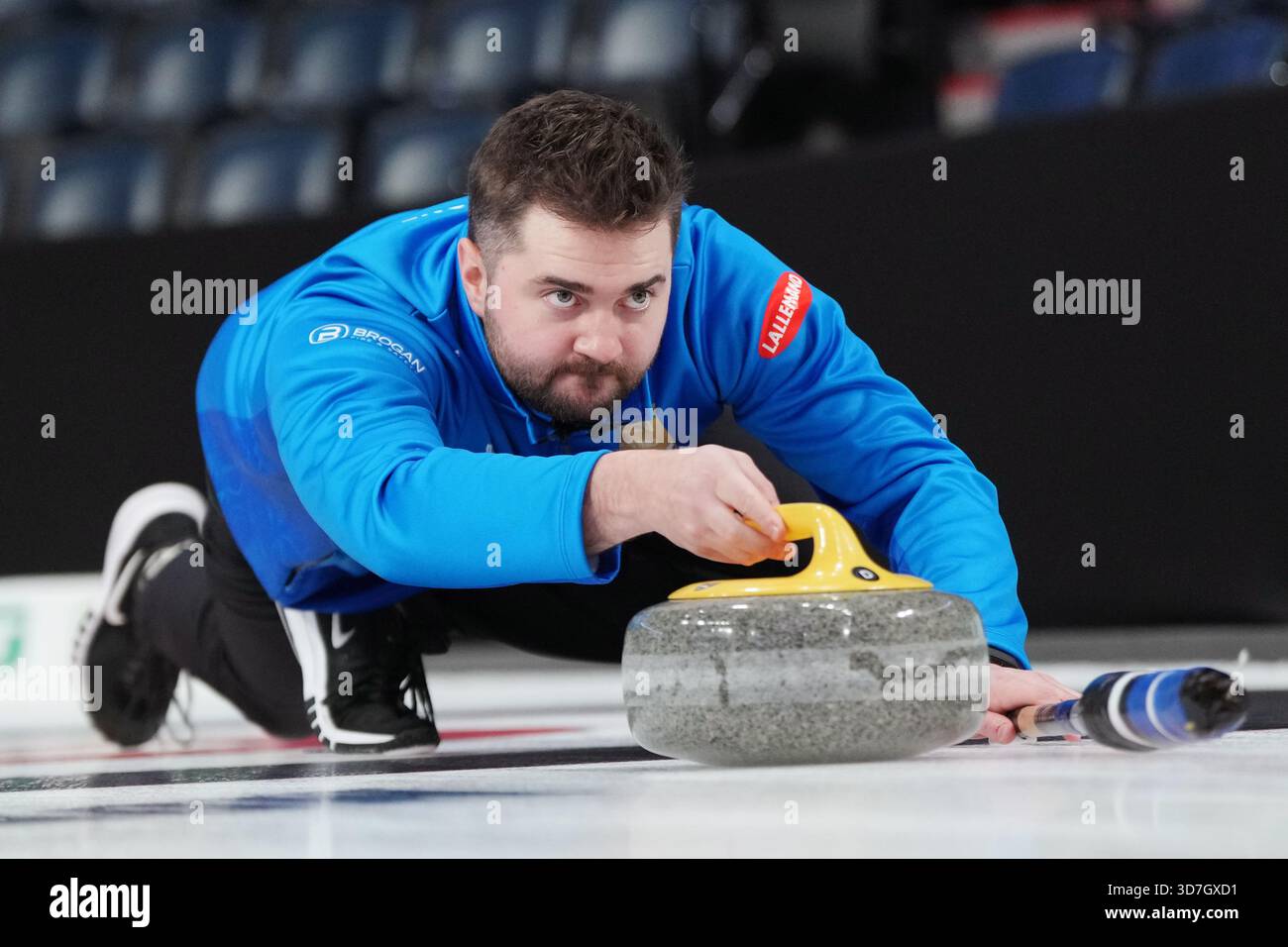 Matt Dunstone throws a rock during Canadian Olympic curling trials ...