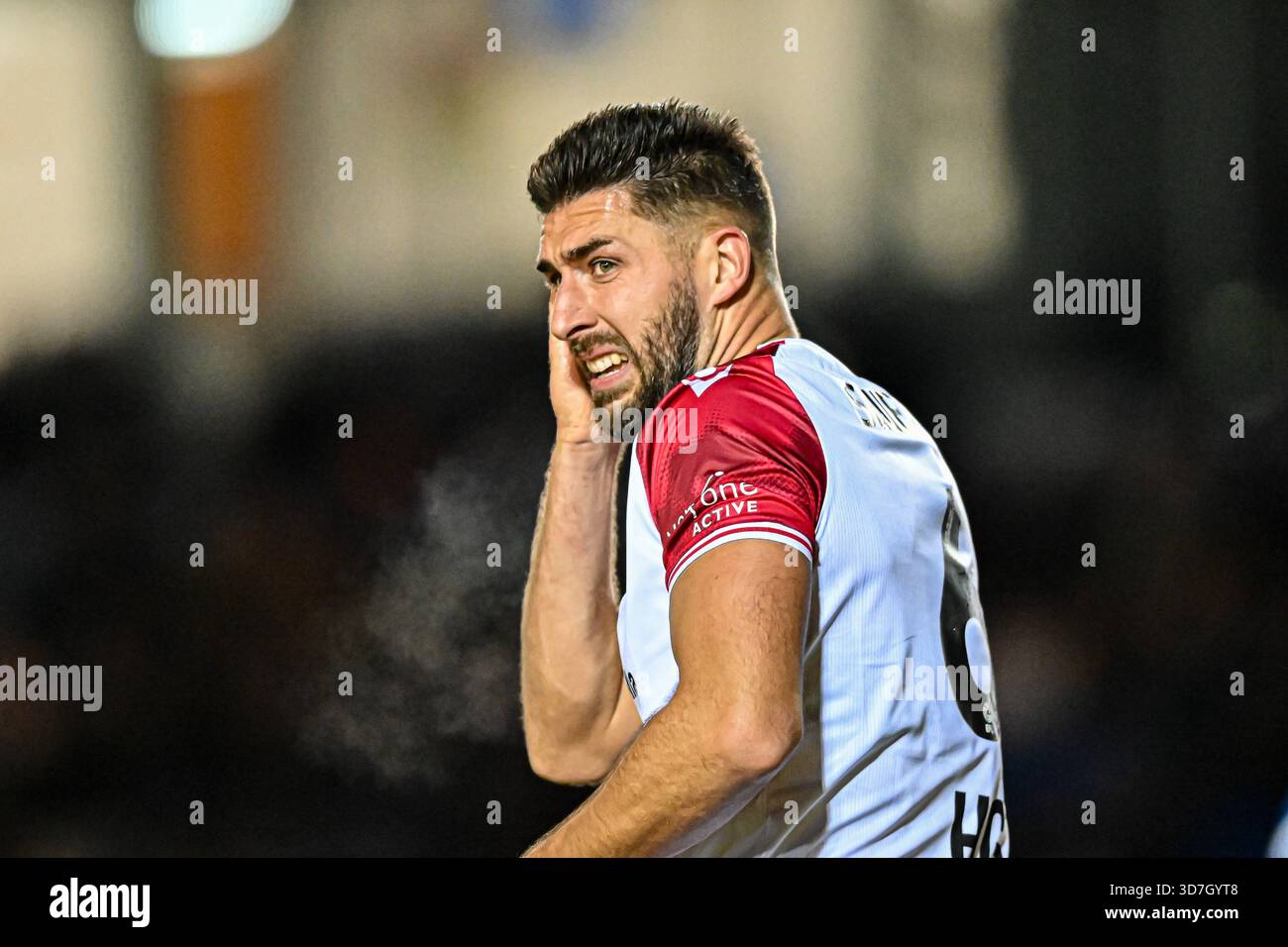 Dan Sweeney (6 Stevenage) holds head after clash during the Sky Bet ...