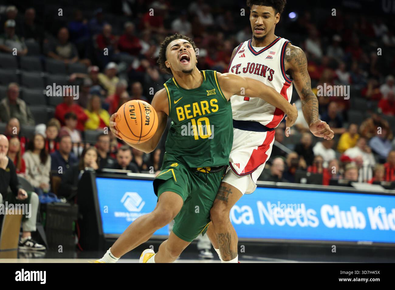 Baylor guard Isaac Williams (10) controls the ball near St. John's ...