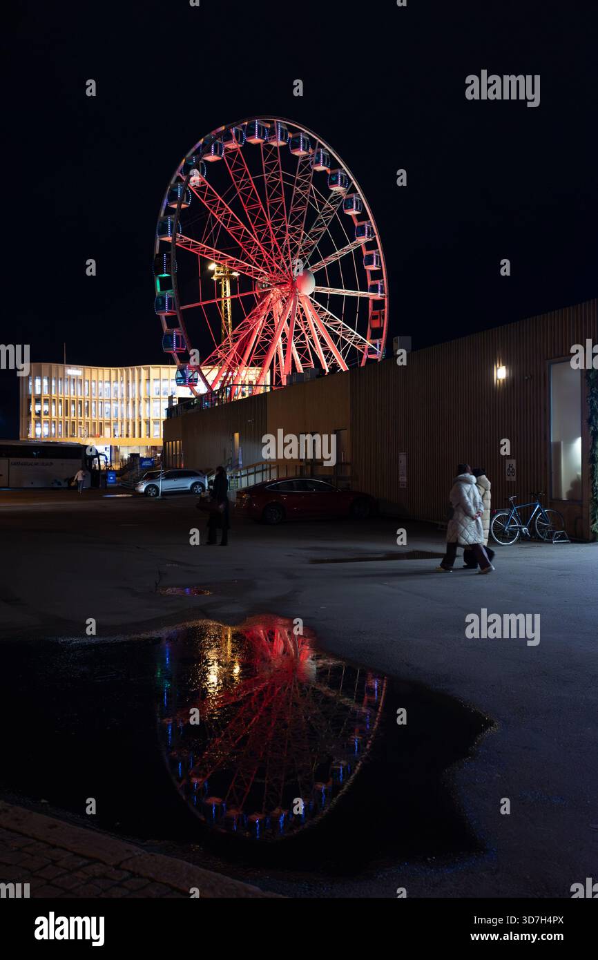 November 25, 2025, Helsinki, Uusimaa, Finaland: People walk through the ...