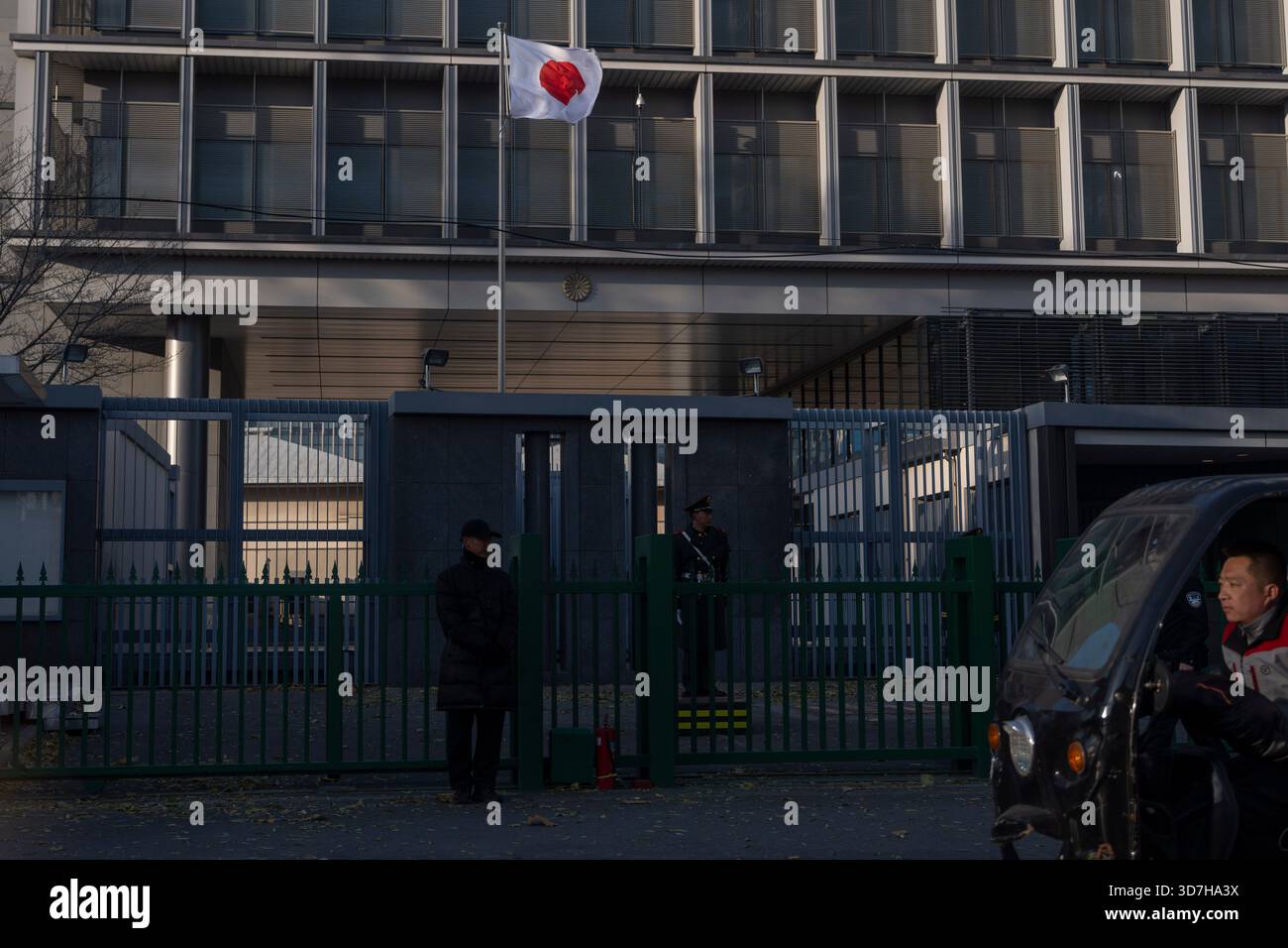 Chinese security personnel guard the entrance to the Japanese embassy ...