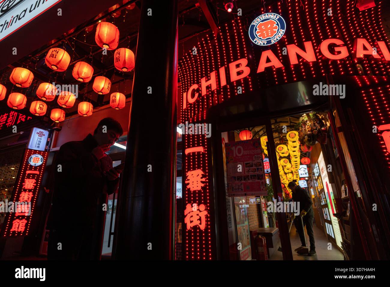 A man smokes outside a building known for its Japanese restaurants in ...