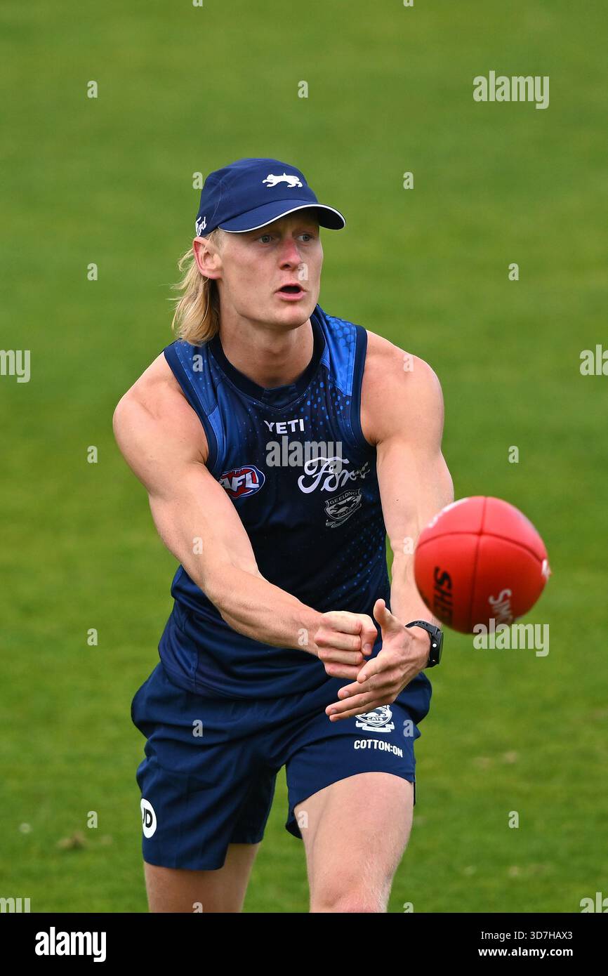 Oliver Dempsey of Geelong handballs the footy during a Geelong Cats AFL ...