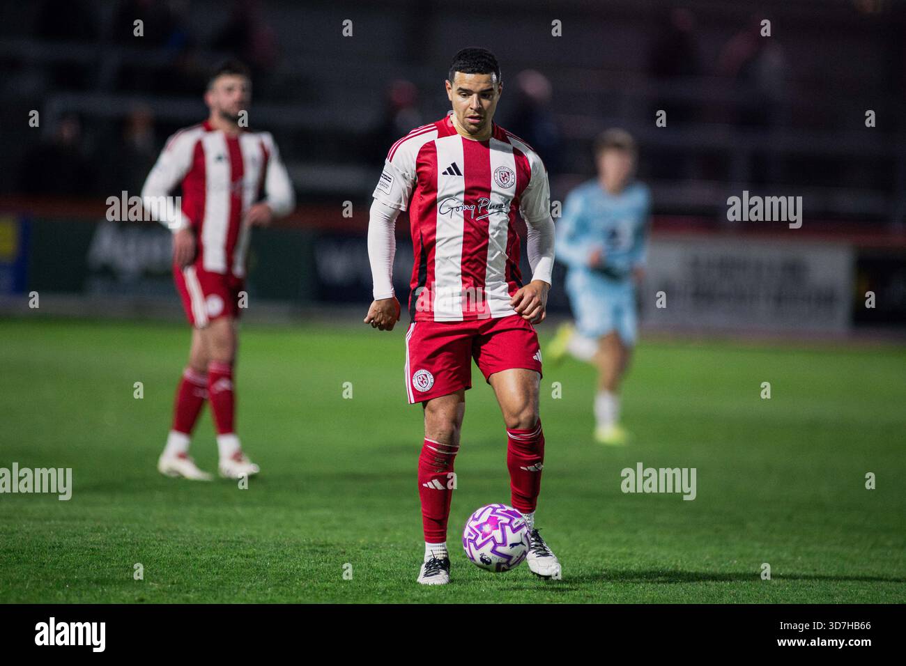 Brackley, UK. 25th Nov, 2025. Tyler Lyttle (2 Brackley Town) running ...