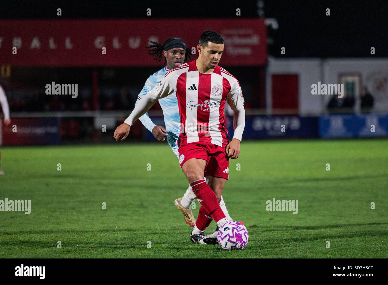 Brackley, UK. 25th Nov, 2025. Tyler Lyttle (2 Brackley Town) passes the ...