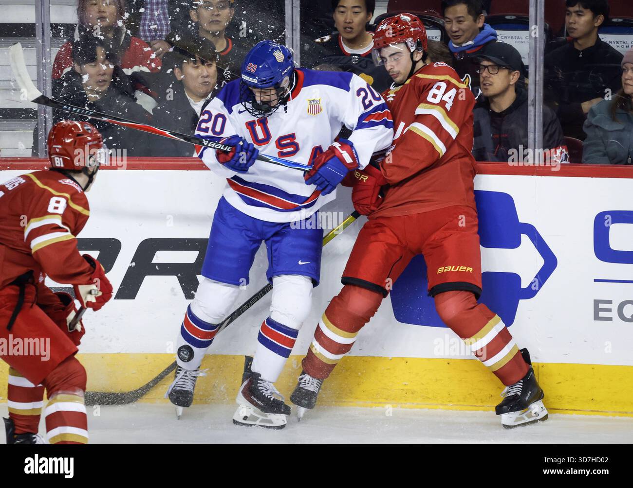 Team USA's Blake Zielinski, left, checks Team CHL's Giorgos Pantelas ...
