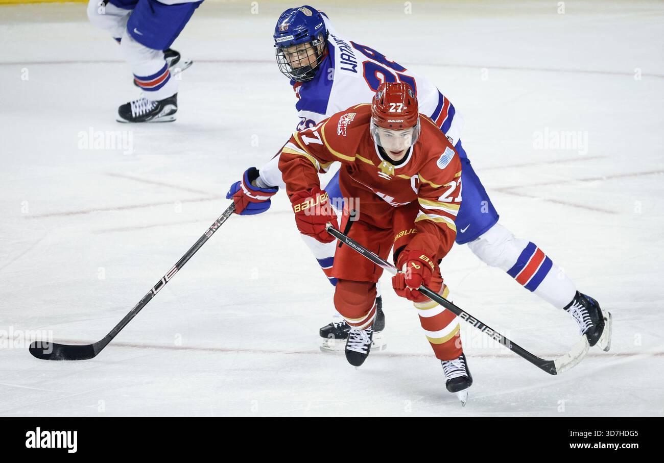 Team USA's Sam Wathier, left, and Team CHL's Caleb Malhotra follow the ...