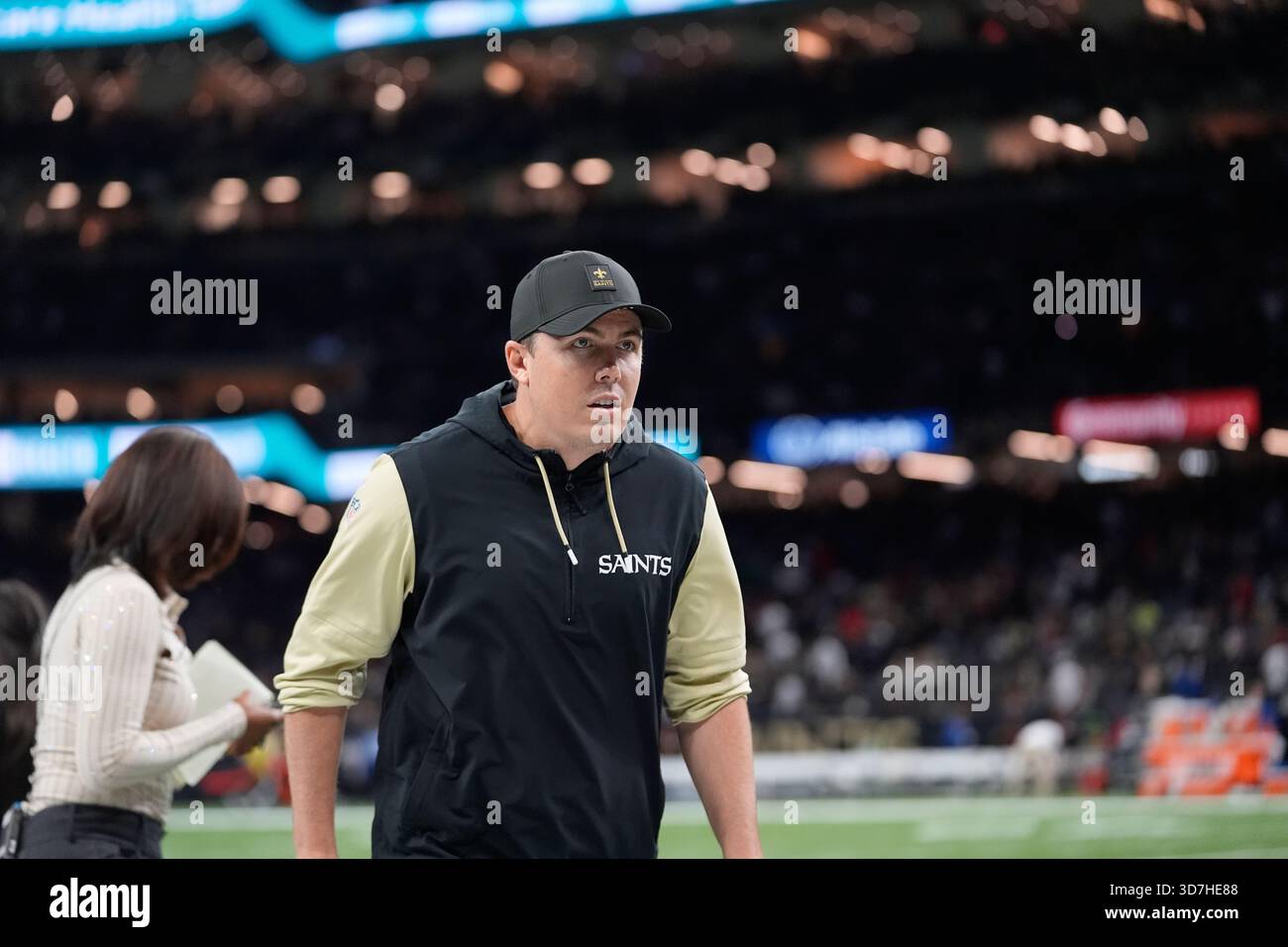 New Orleans Saints head coach Kellen Moore walks of the field for half ...