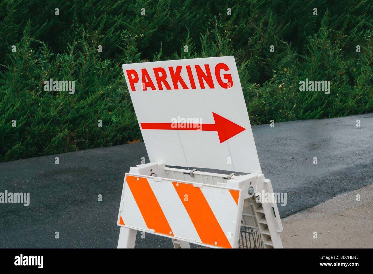 Parking Guide Sign with Red 'PARKING' Text and Arrow Set Against a ...
