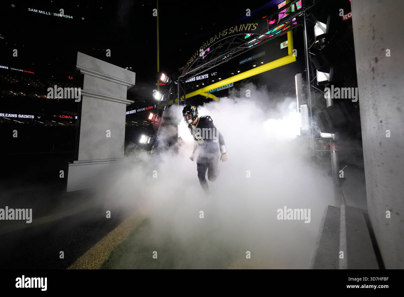 New Orleans Saints quarterback Tyler Shough (6) runs onto the field ...