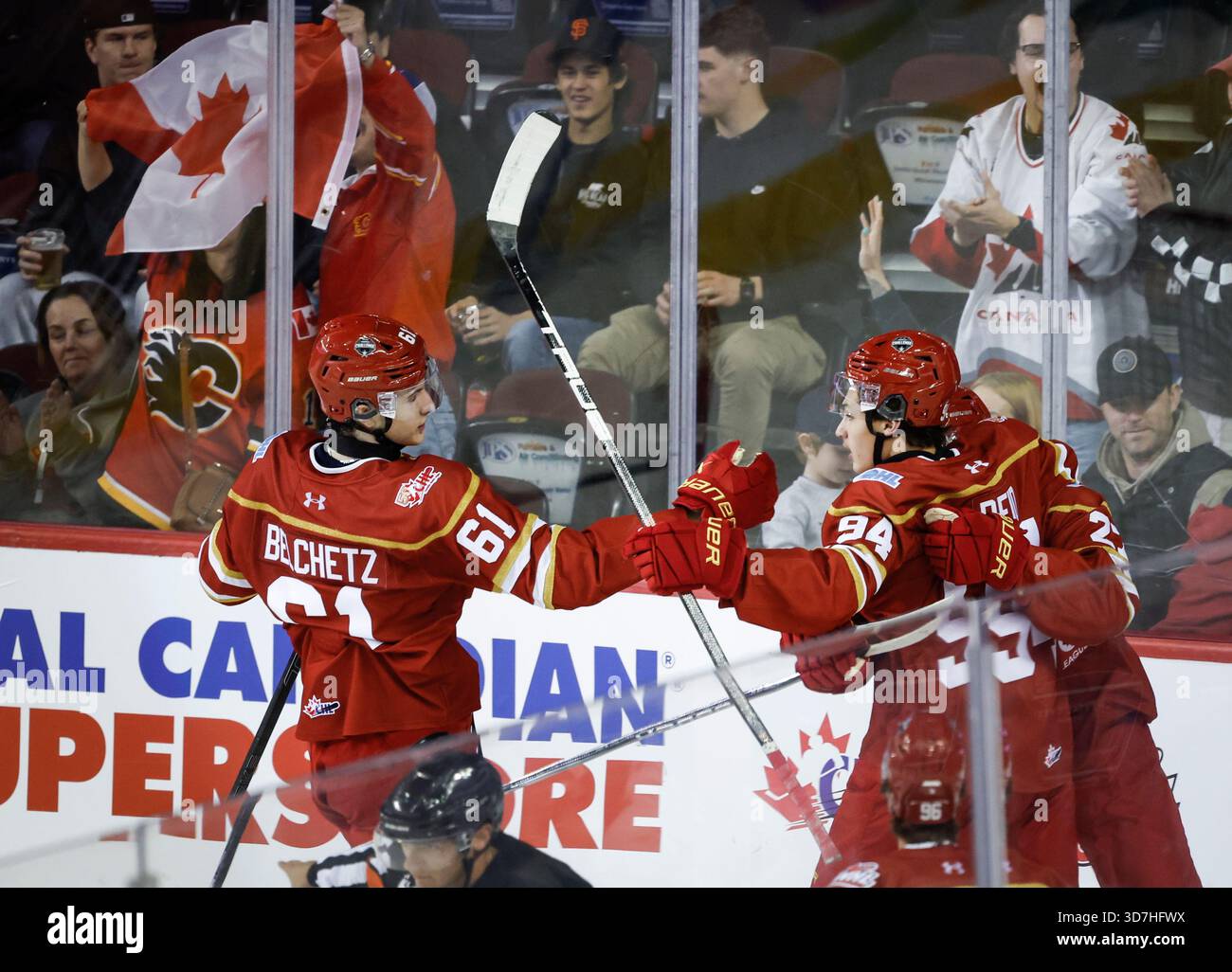 Team CHL's Chase Reid, right, celebrates his goal with teammate Ethan ...