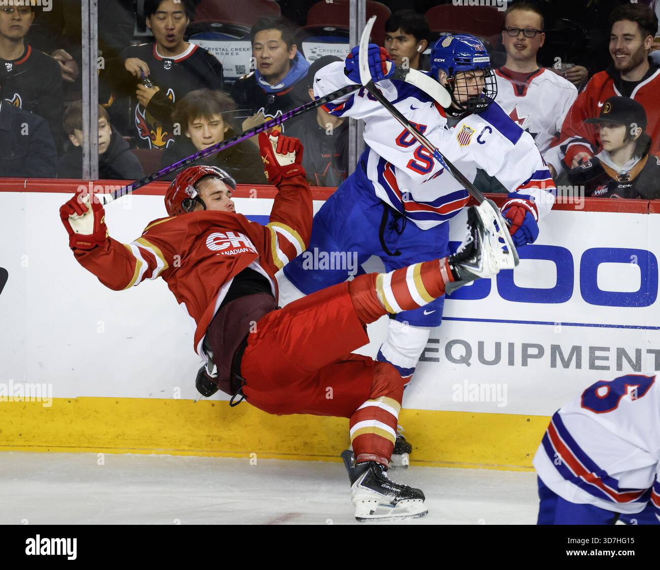 Team USA's Casey Mutryn, right, checks Team CHL's Adam Novotny during ...