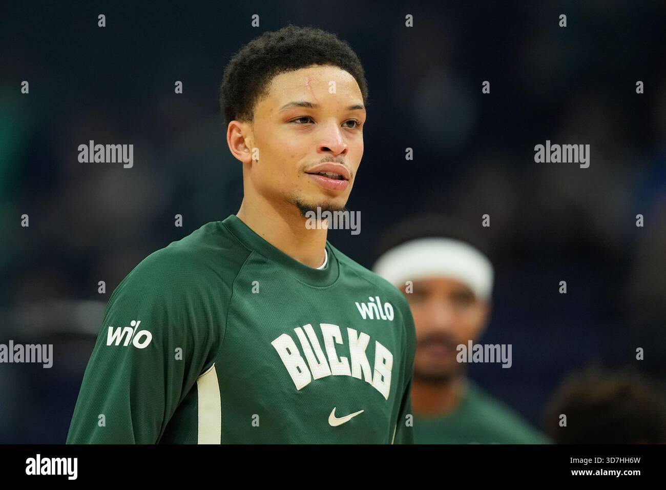 Milwaukee Bucks' Ryan Rollins warms up before an NBA basketball game ...