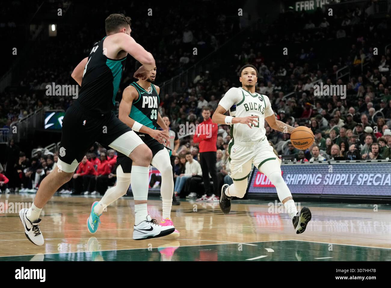 Milwaukee Bucks' Ryan Rollins drives to the basket against Portland ...