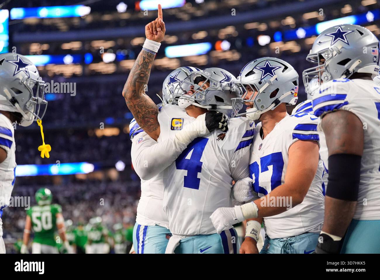 Dallas Cowboys' Dak Prescott (4) and others celebrate Prescott's ...