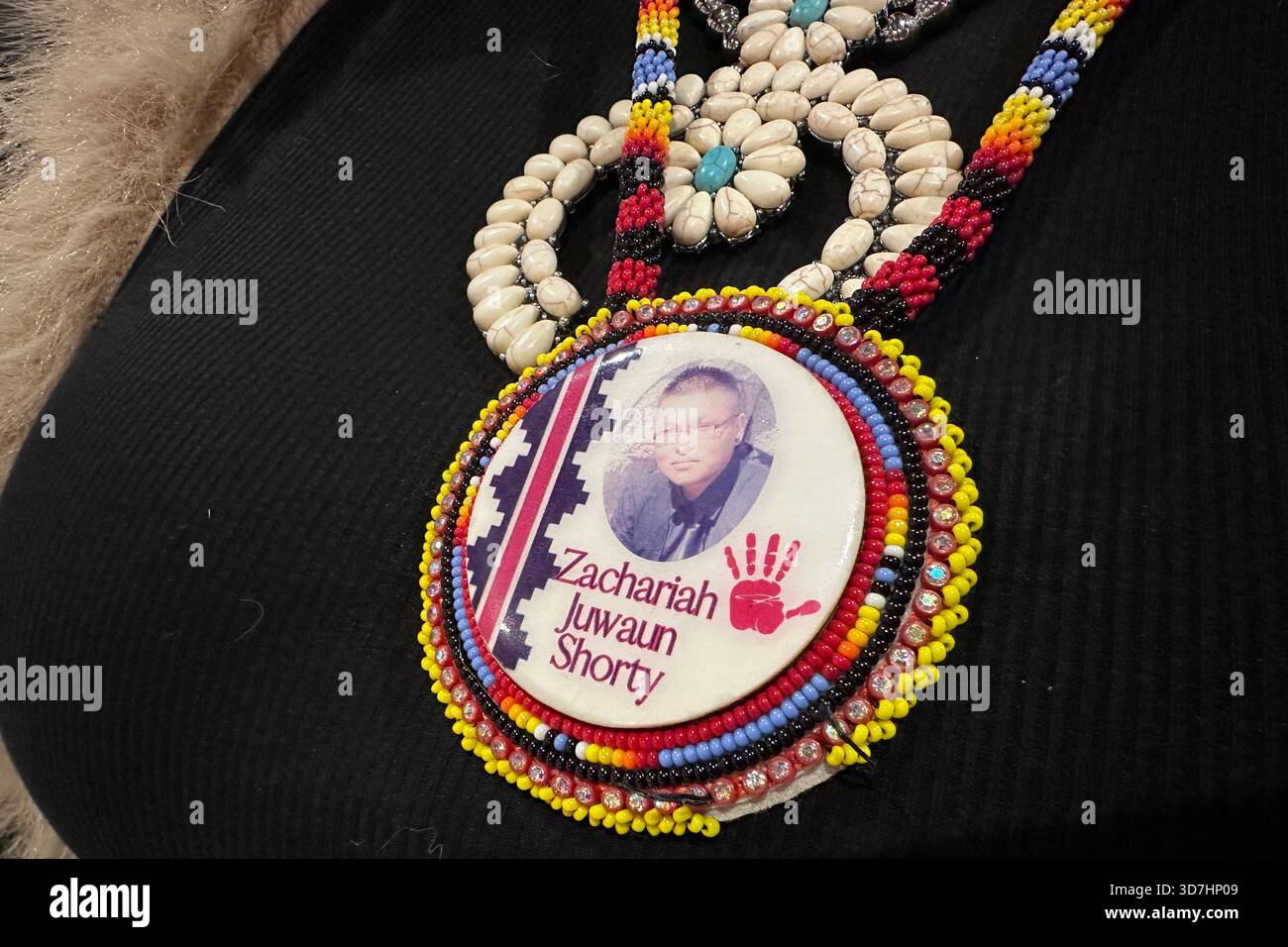 Vangie Randall-Shorty wears a button in memory of her son Zachariah ...