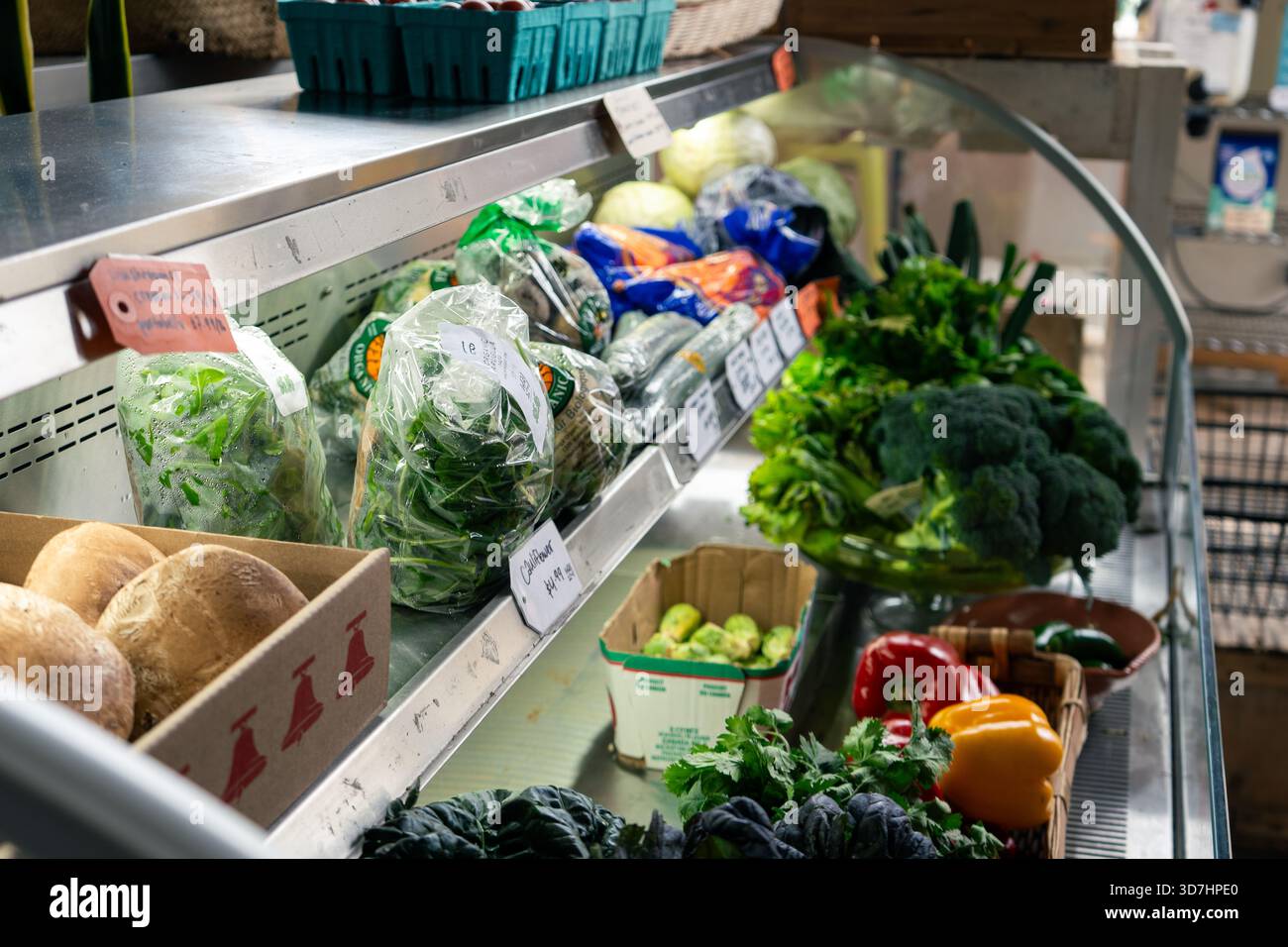 Showcase of farm-fresh produce displayed in an inviting refrigerated ...