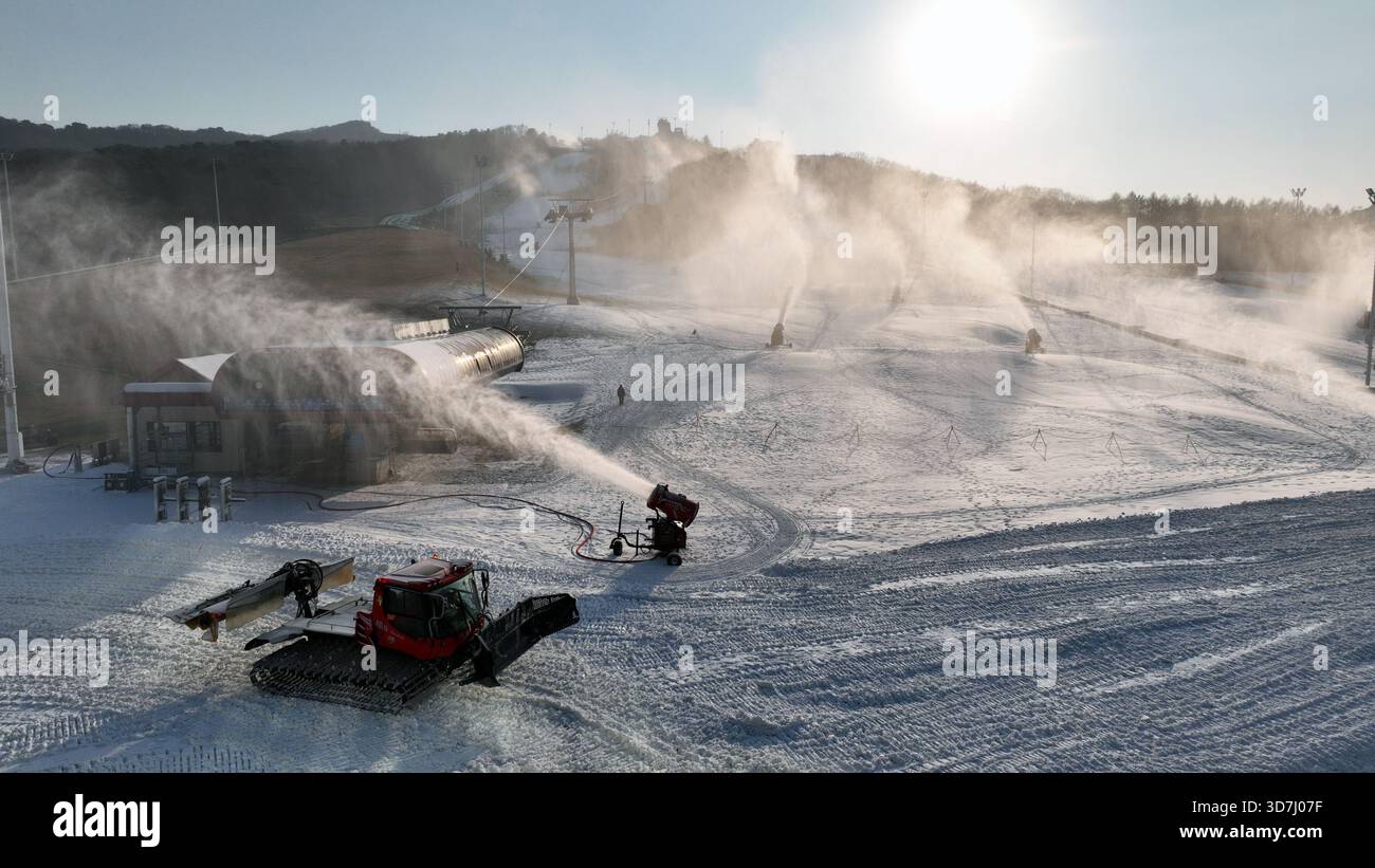 SHENYANG, CHINA - NOVEMBER 25, 2025 - Snowmaking machines are making ...