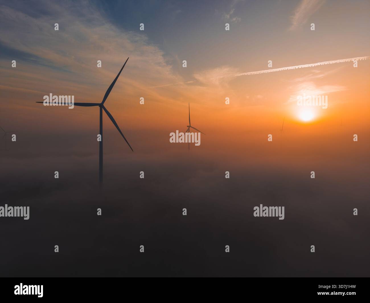 Wind turbines rising above solar hi-res stock photography and images ...