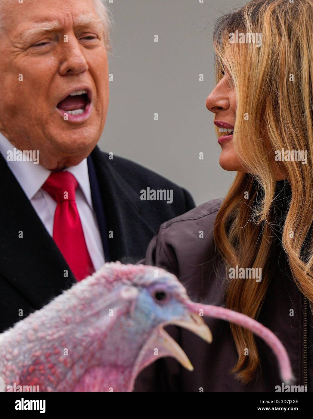 FILE - President Donald Trump and first lady Melania Trump stand next ...