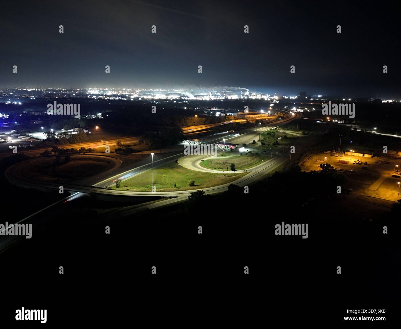 City lights shimmer below as seen from a high observation point at ...