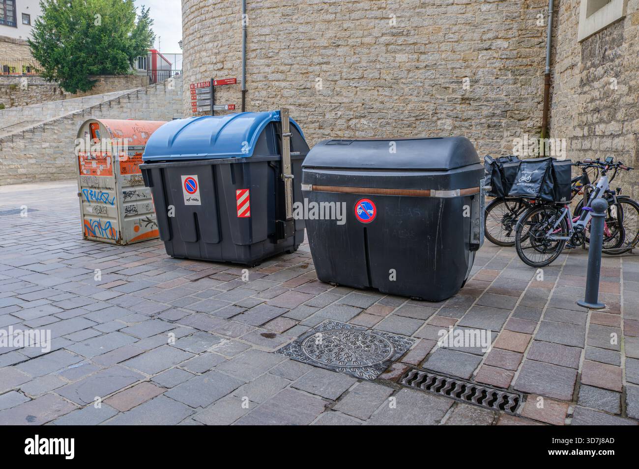 Urban Waste Bins and Parked Bicycles on a Cobblestone Street, Stone ...
