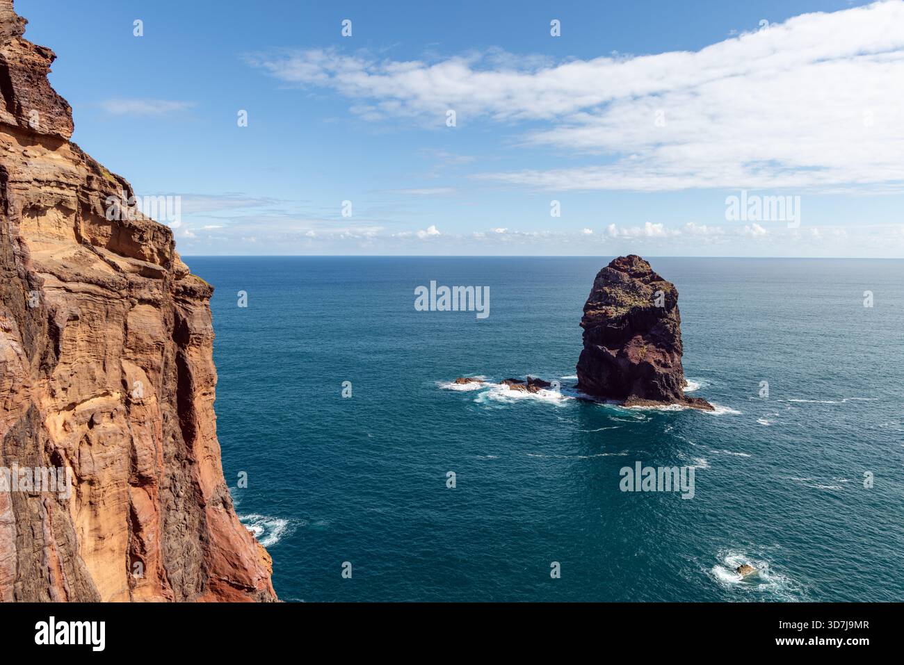 Massive sea stack rises from the Atlantic near Sao Lourenco Point in ...