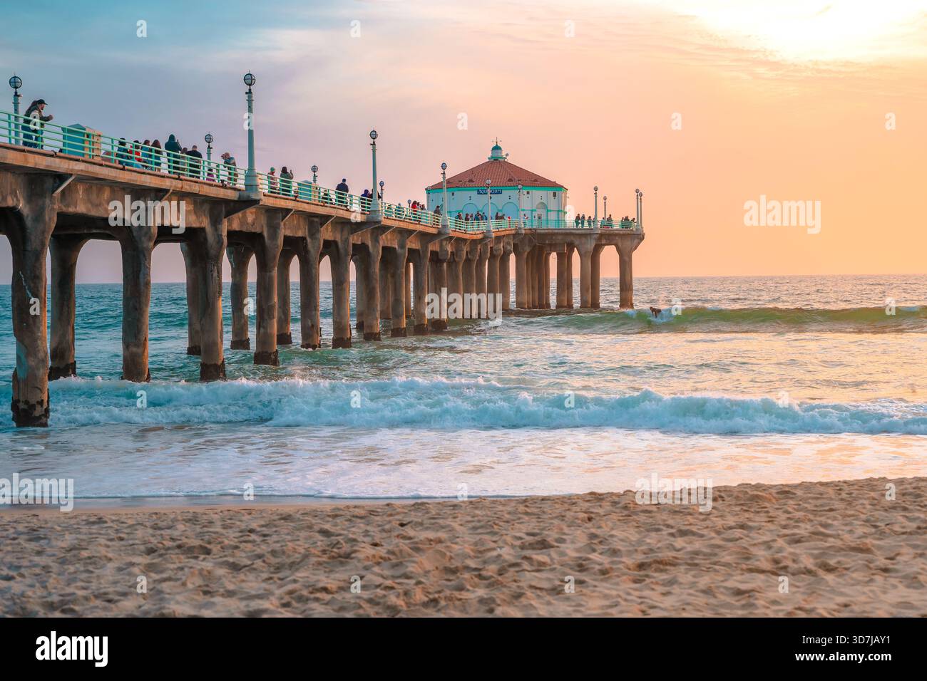 Manhattan beach pier at sunset, orange-pink sky with bright colors, beautiful landscape with ...
