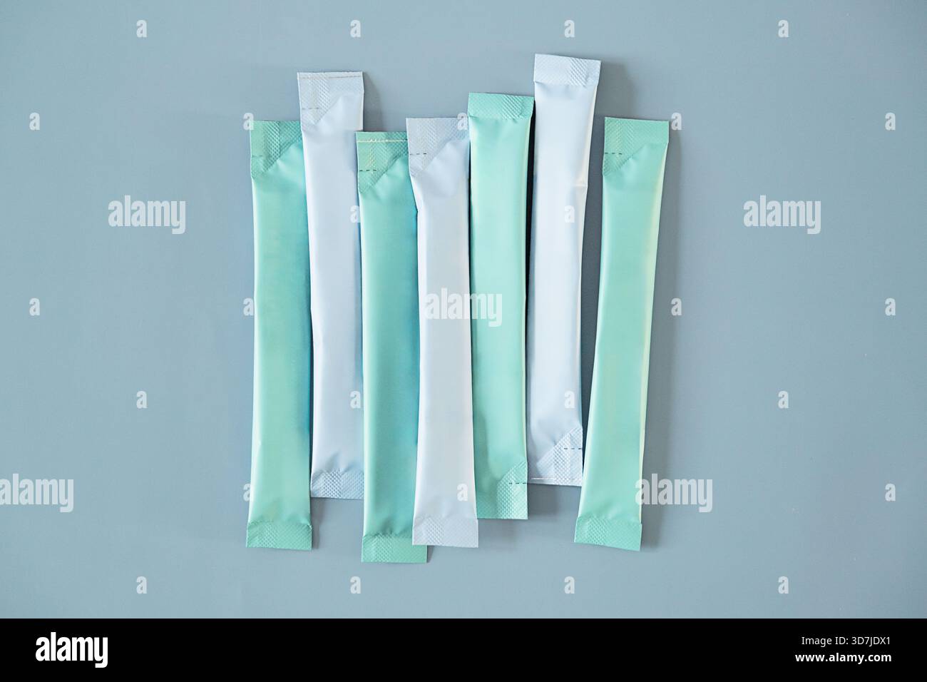 Minimalistic layout of powder stick sachets. Convenient single serve ...