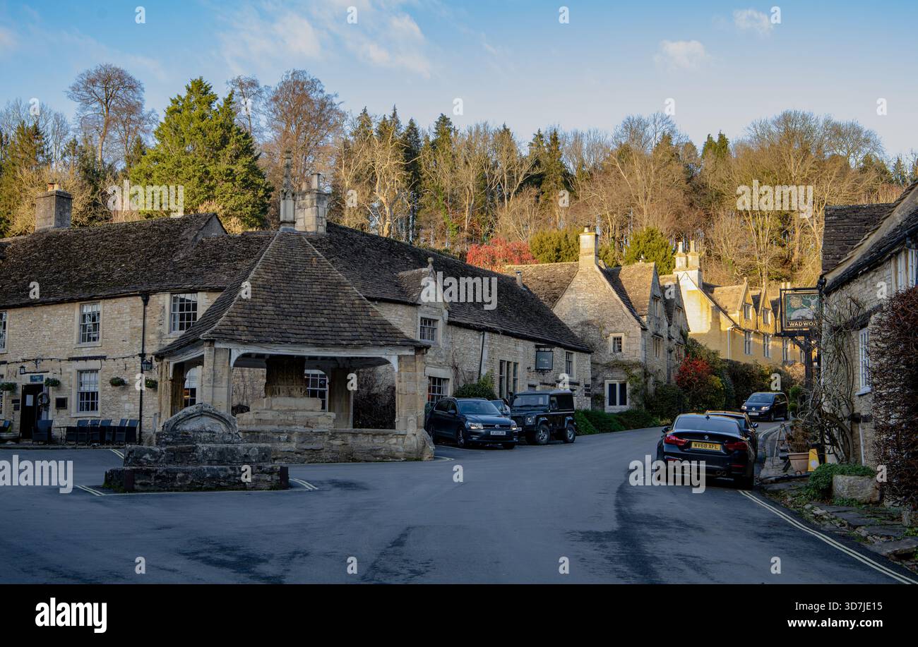 The charming village street in Castle Combe with the historic stone ...