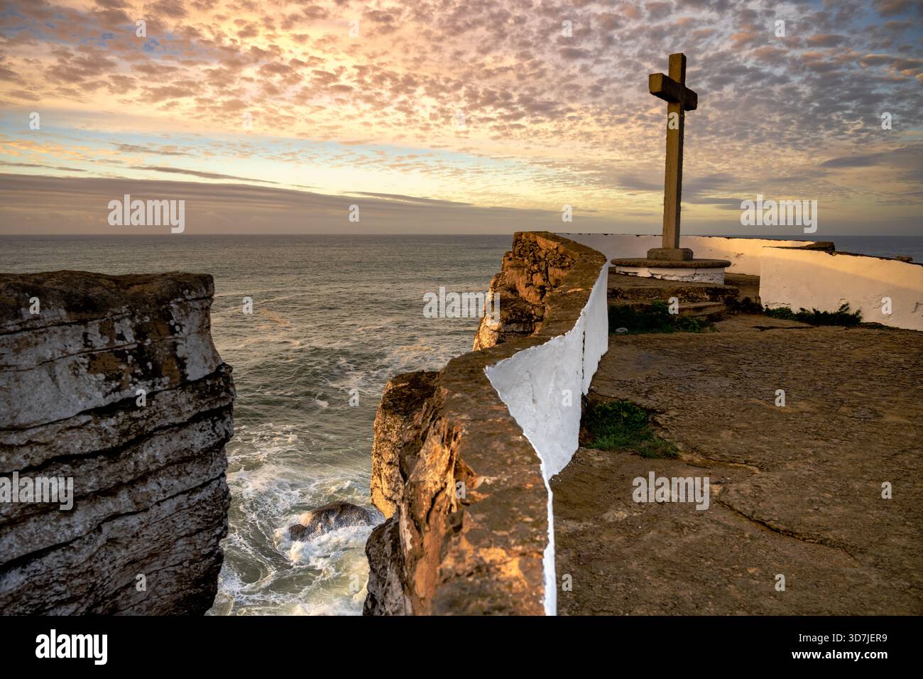 Peniche Portugal November 9 2025. A coastal cross stands beside a white ...