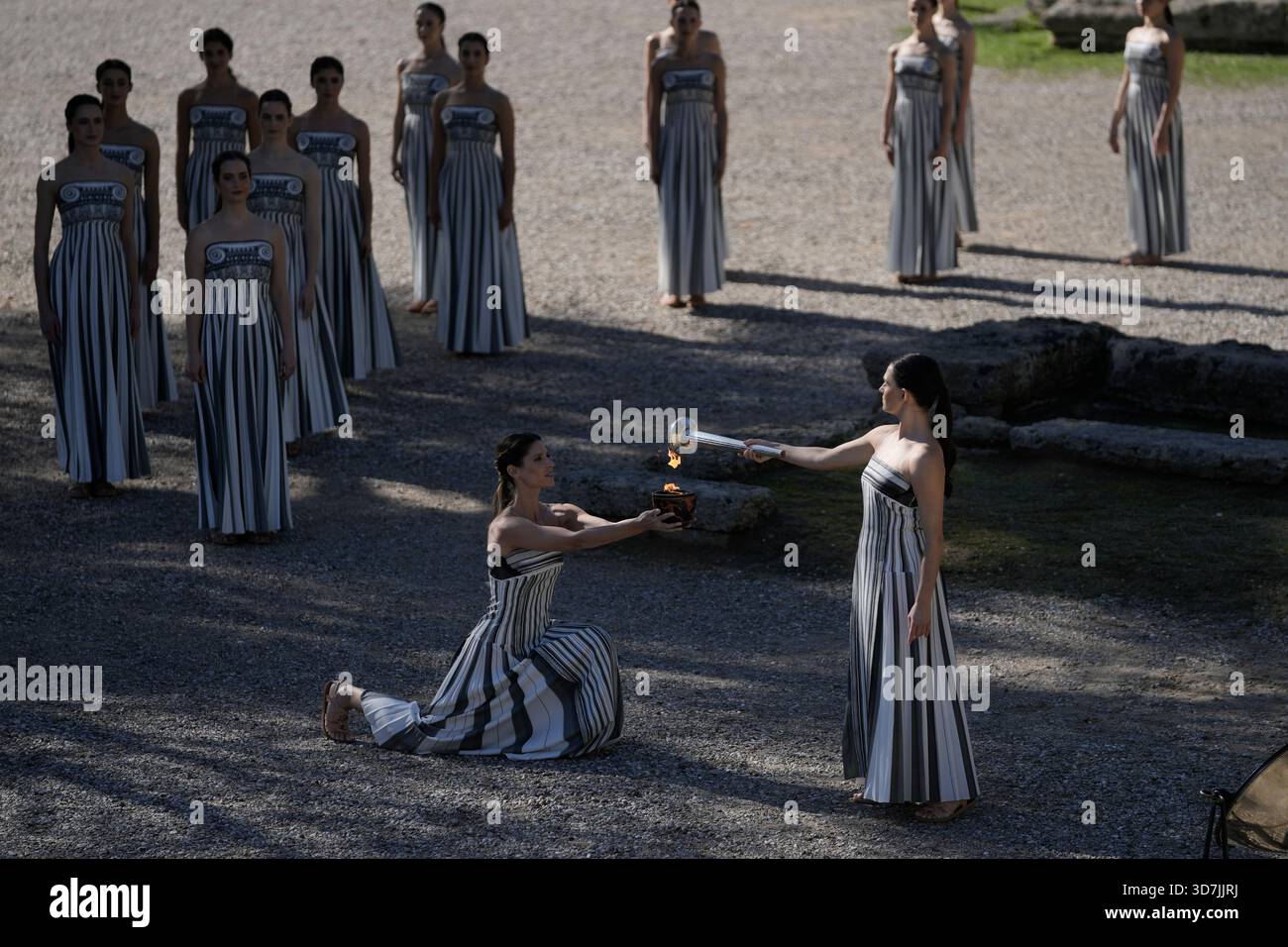 Actress Mary Mina, right, playing the role of high priestess performs ...