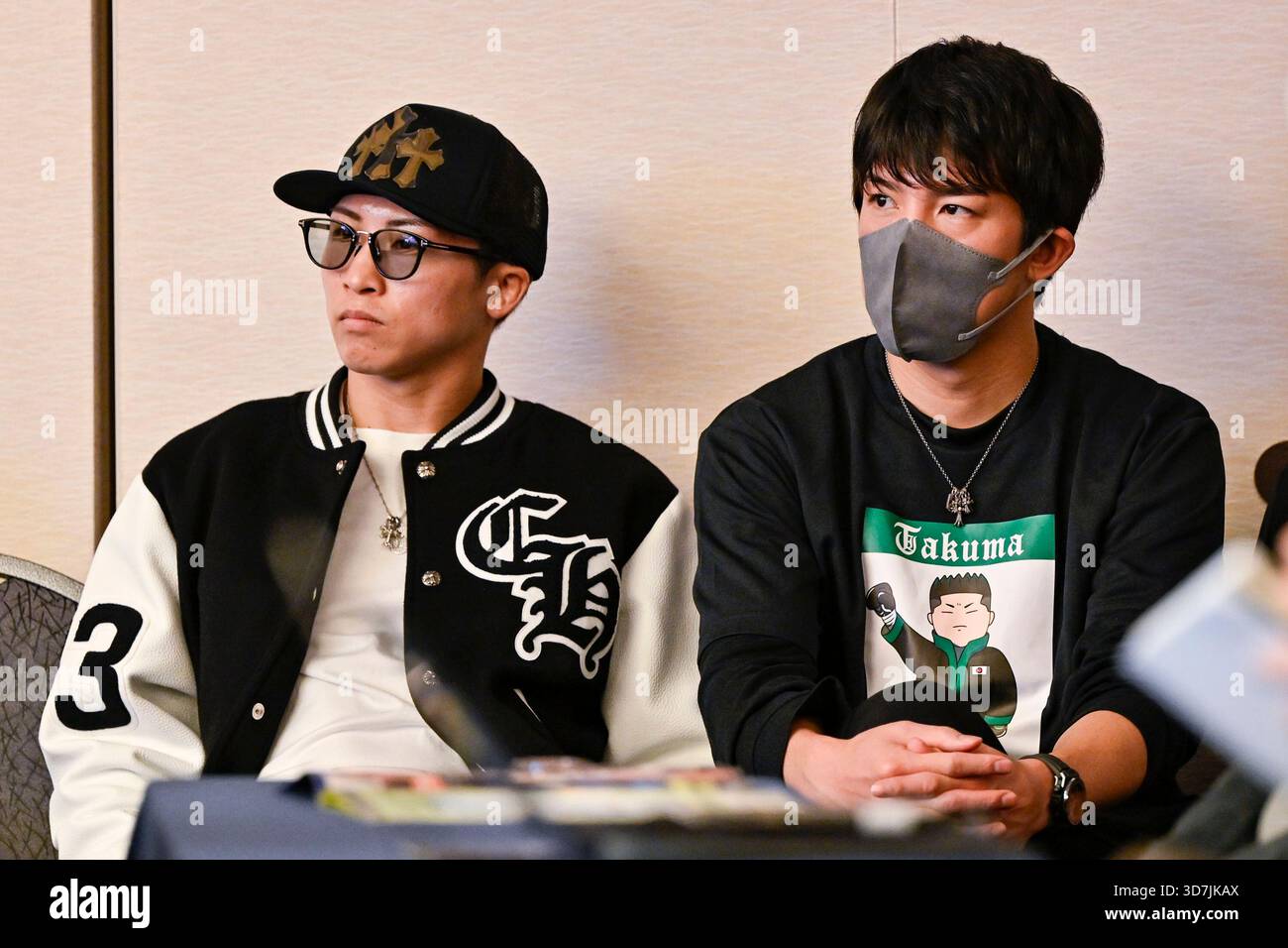 Takuma Inoue's brother Naoya Inoue, left, and cousin Koki Inoue are seen during a press ...