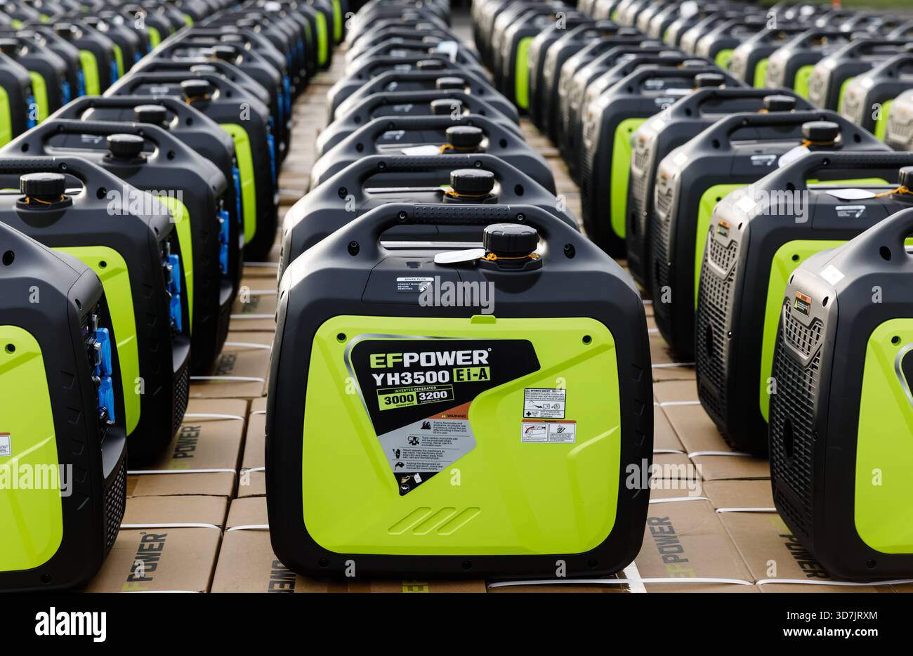A row of new, portable electric generators, branded "EFPOWER," is seen ...