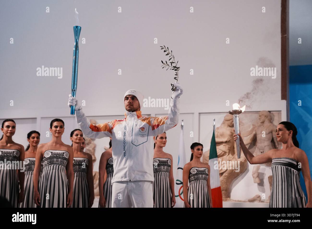 The first torchbearer Greek rower Petros Gaidatzis, holds the olympic ...