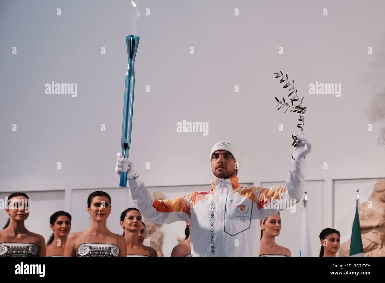 The first torchbearer, Greek rower Petros Gaidatzis, holds the olympic ...