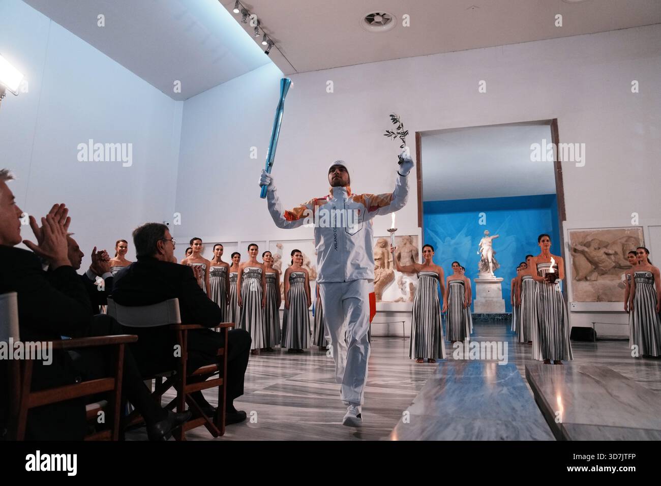The first torchbearer Greek rower Petros Gaidatzis, carries the olympic ...