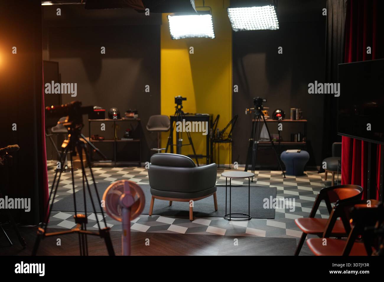 FILE - An empty chair takes center stage at a TV studio set where ...