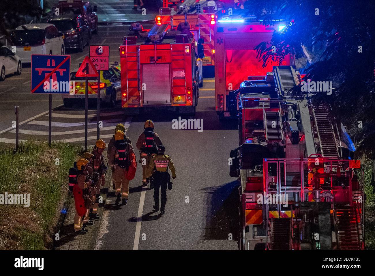 Firefighters work to extinguish a fire which broke out at Wang Fuk ...