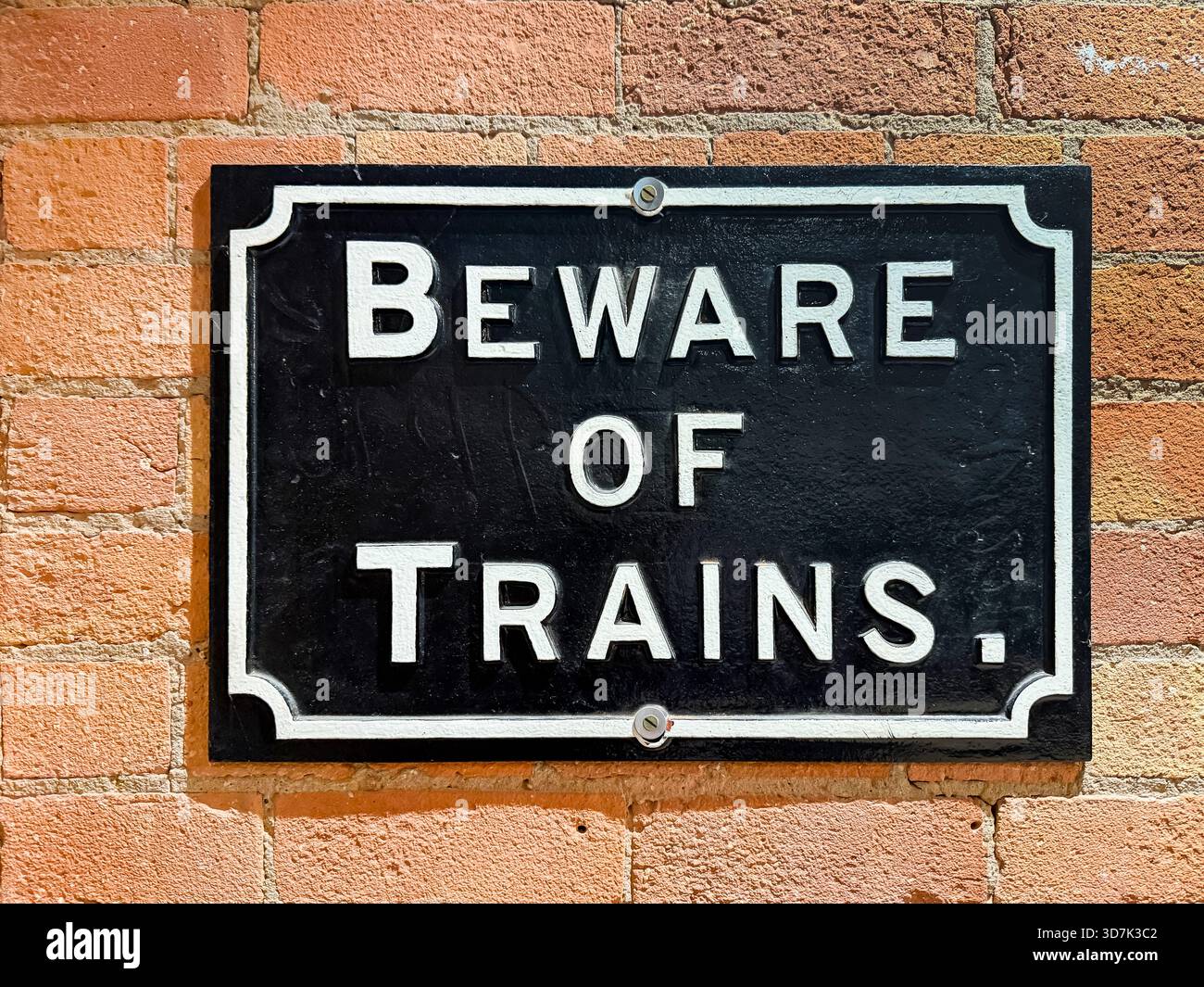 cast iron Black and white warning sign reading 'Beware of Trains ...