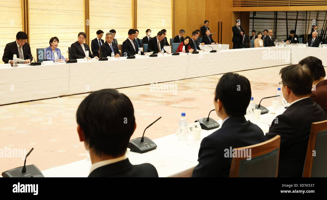 Japanese Prime Minister Sanae Takaichi (second from left) delivering a ...