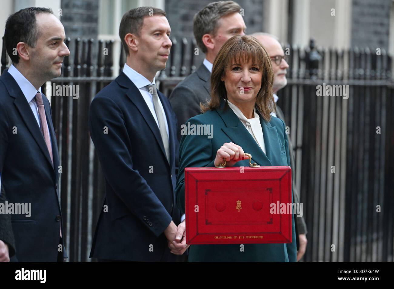 Britain's Chancellor of the Exchequer Rachel Reeves hold up her ...