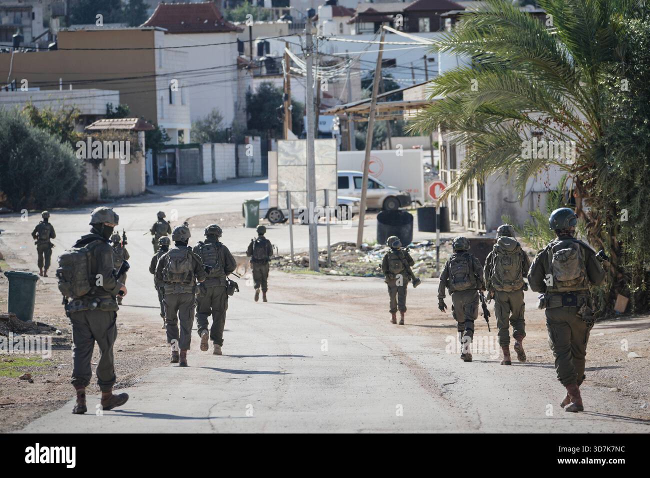 Israeli soldiers are seen during an army raid in the West Bank town of ...