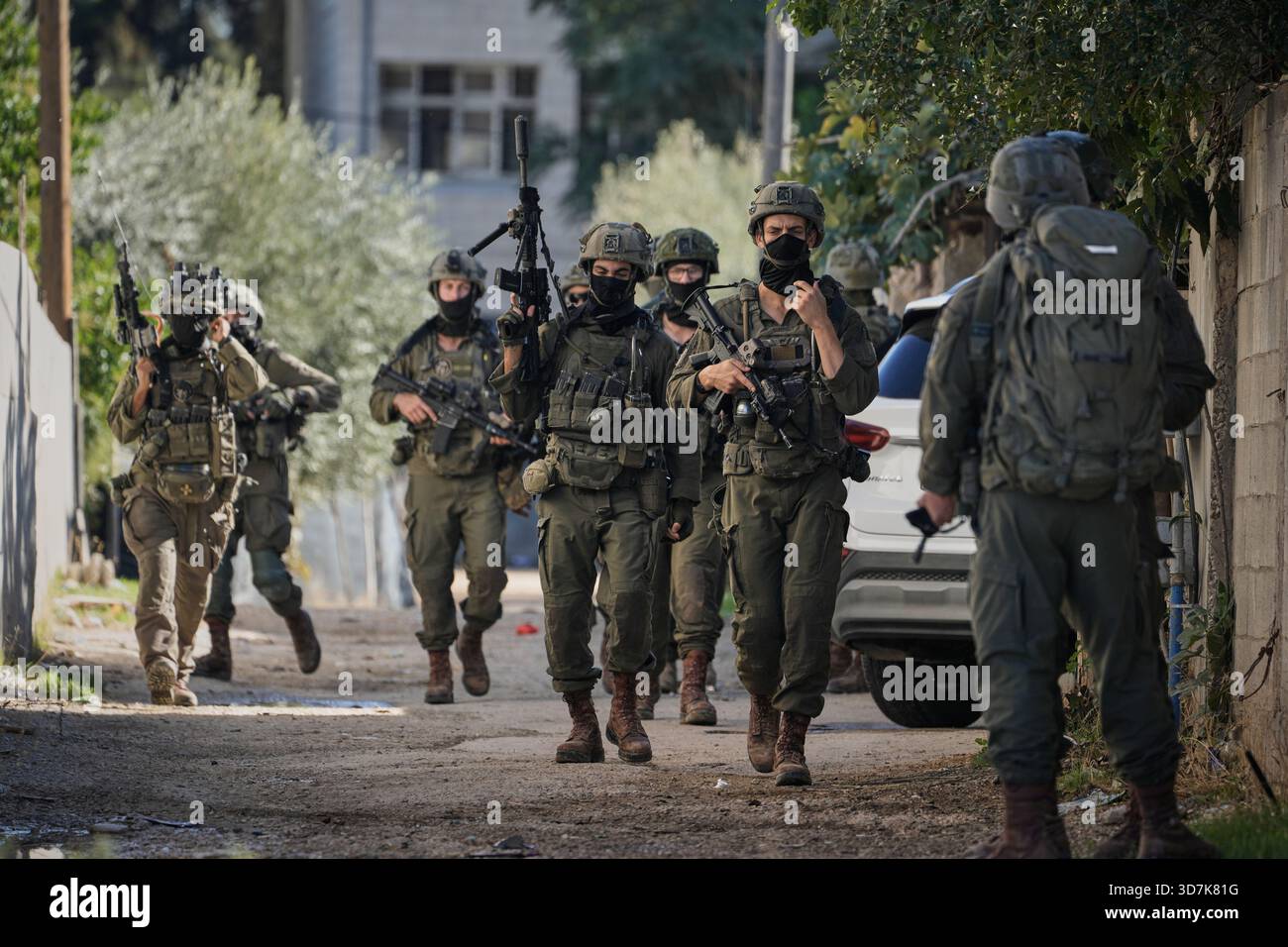 Israeli soldiers are seen during an army raid in the West Bank town of ...
