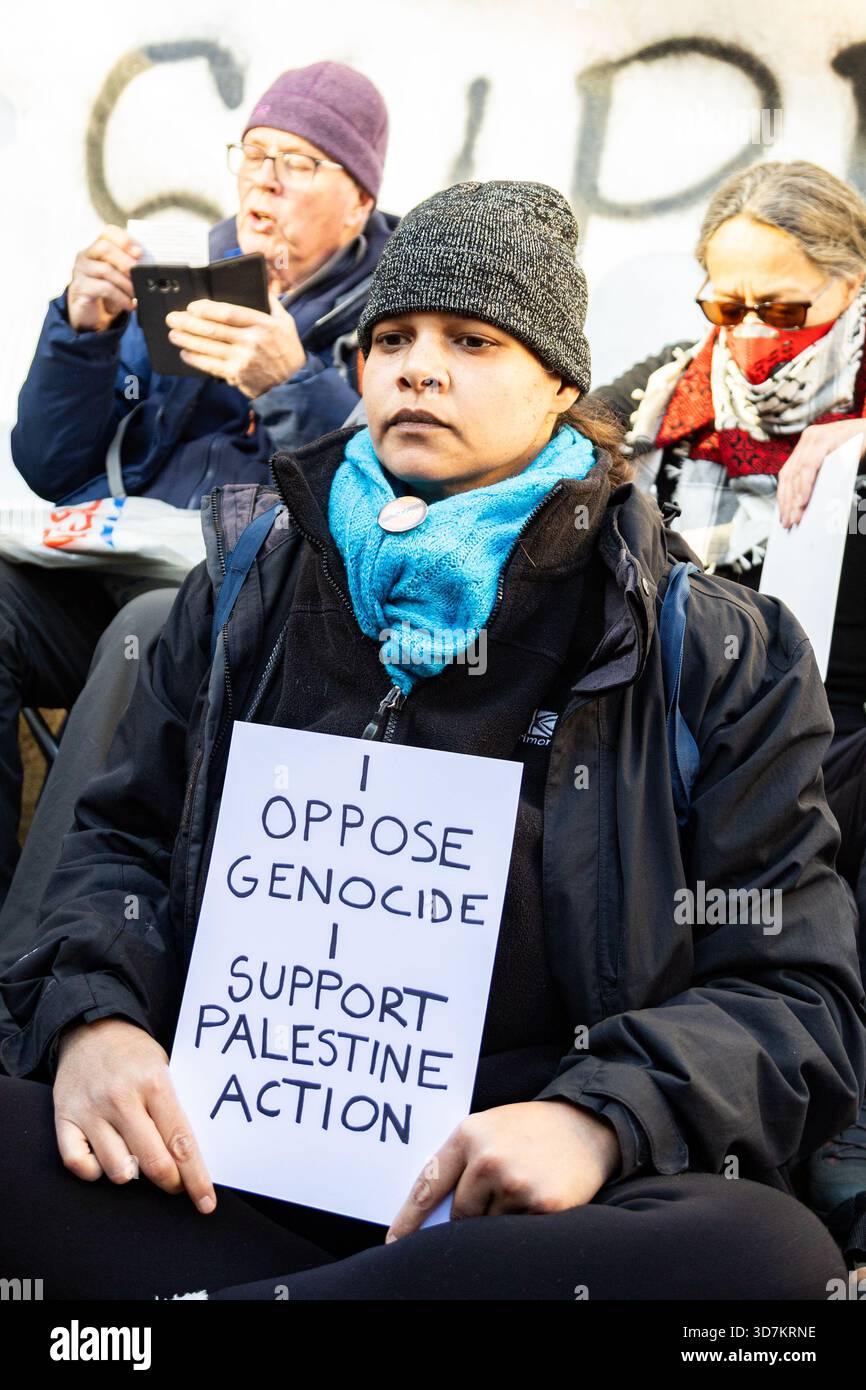 placard being held at Defend Our Juries protest on the ban of Palestine ...