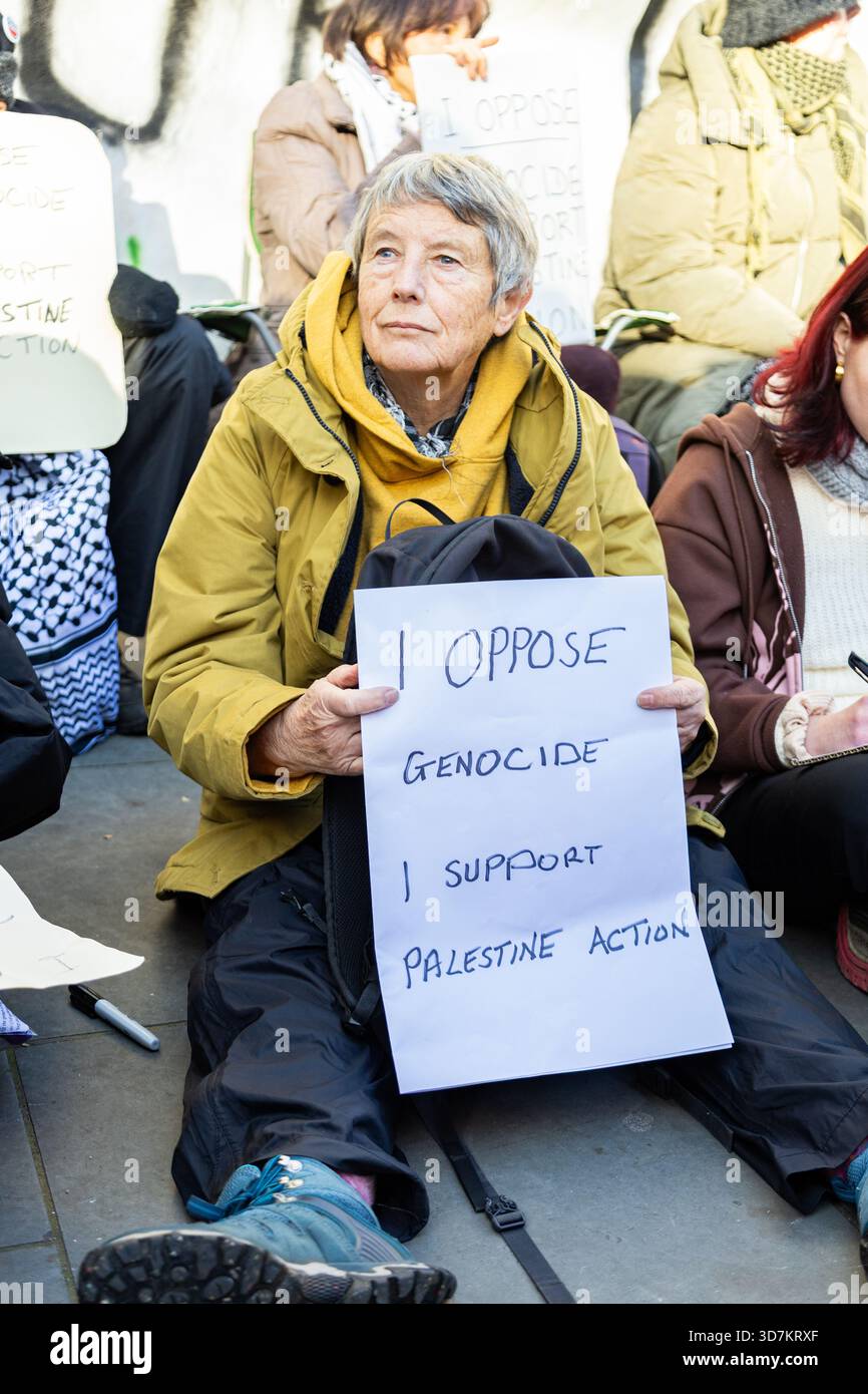 placard being held at Defend Our Juries protest on the ban of Palestine ...