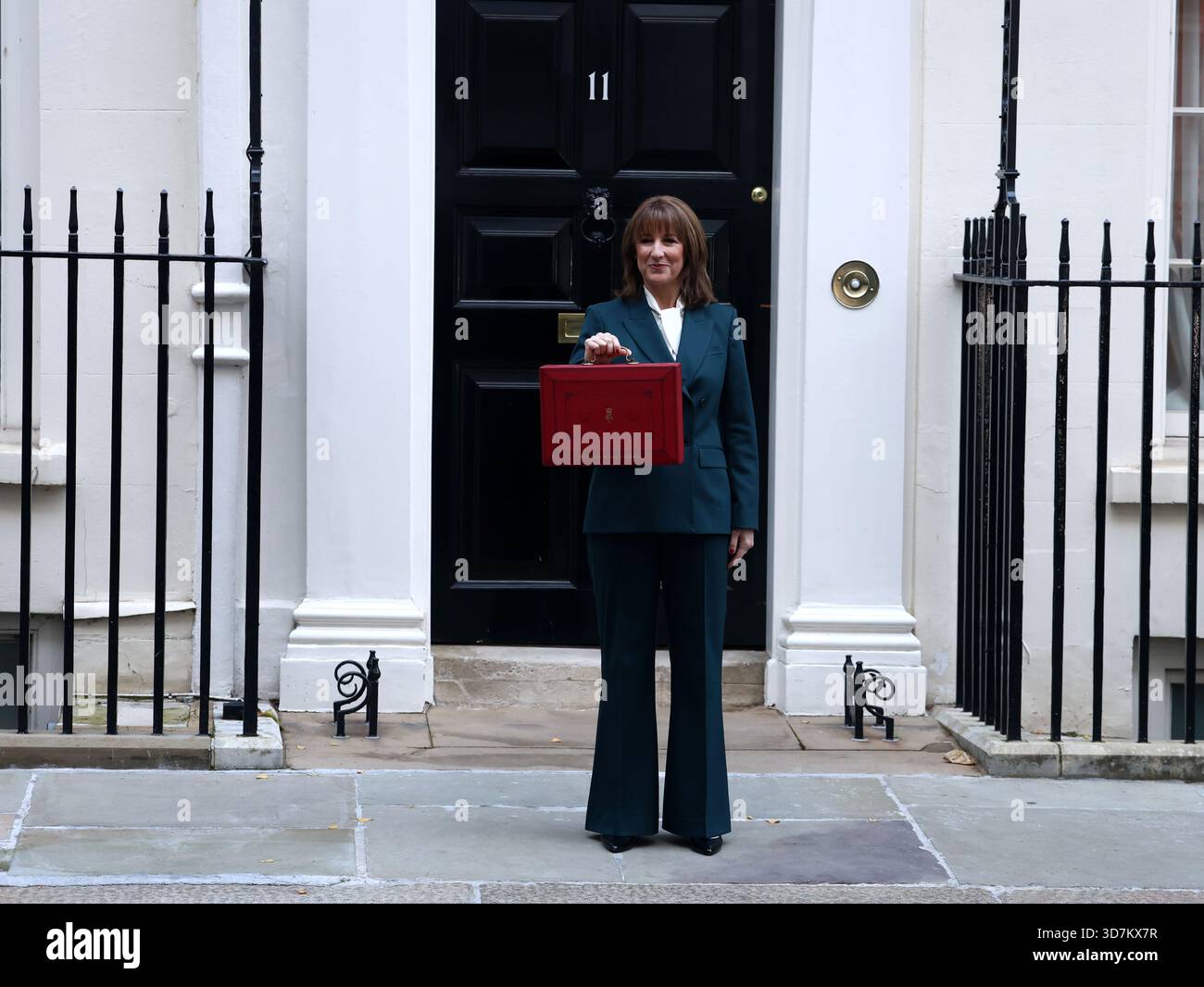 Chancellor of the Exchequer, Rachel Reeves, poses with the red Budget ...
